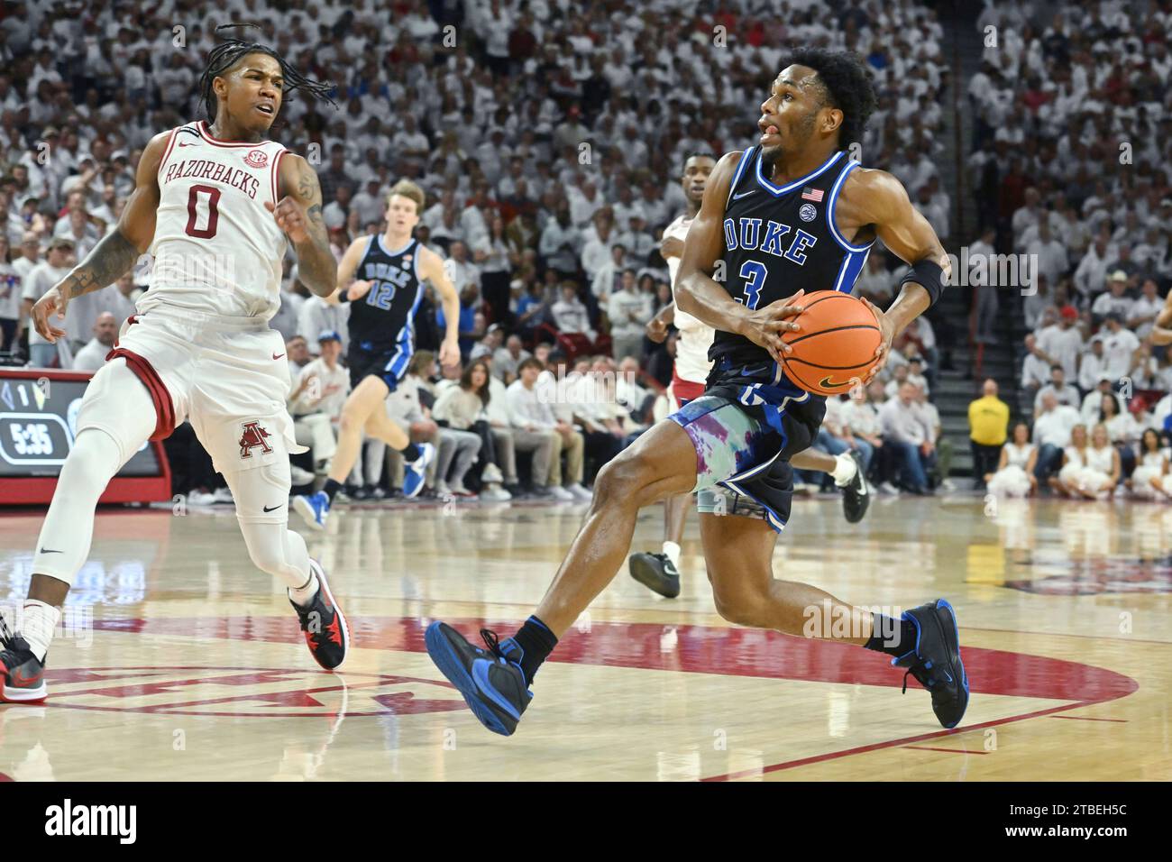 Duke guard Jeremy Roach (3) tries to drive past Arkansas guard Khalif Battle (0) during an NCAA ...