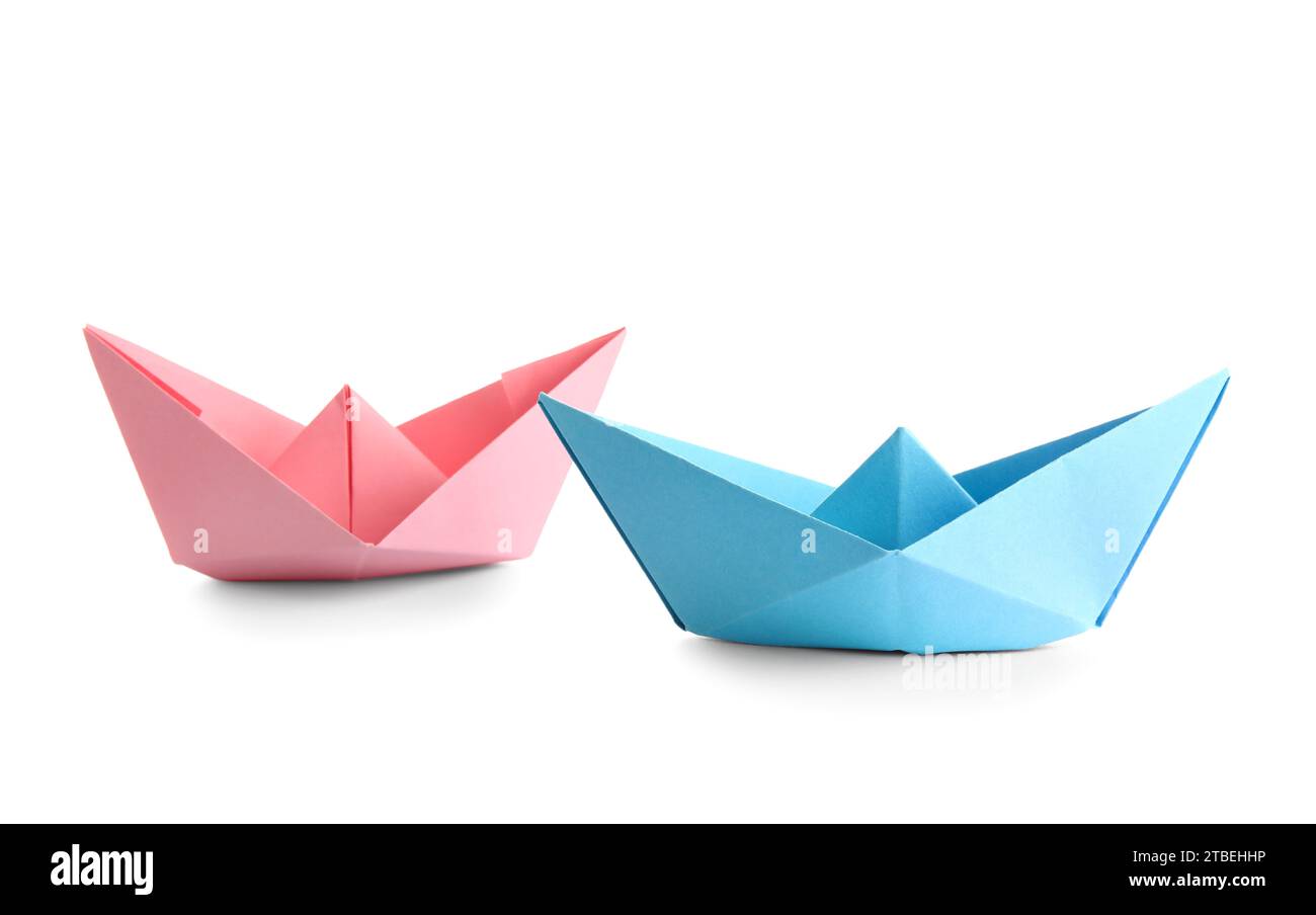Colorful origami boats on white background Stock Photo - Alamy