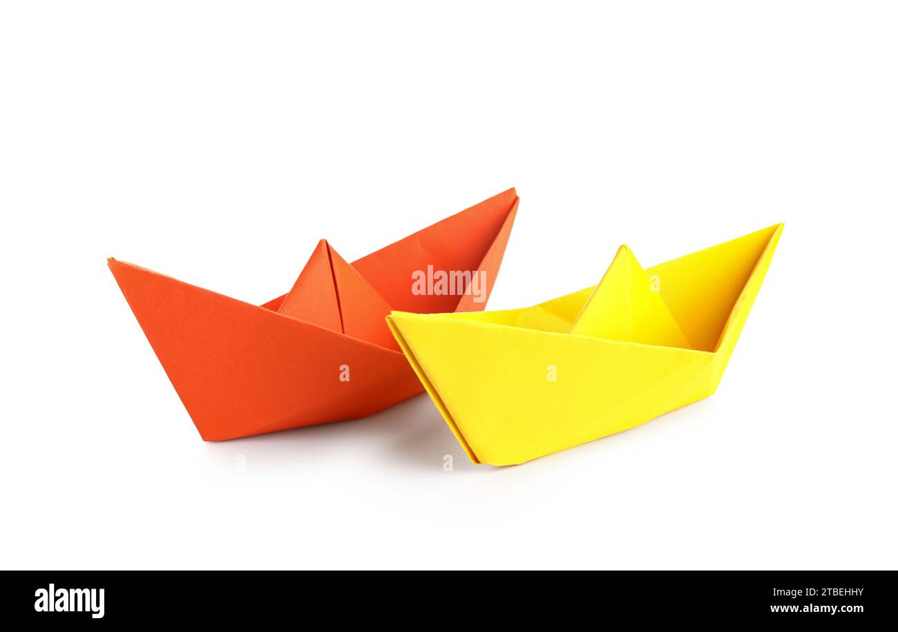 Colorful origami boats on white background Stock Photo - Alamy