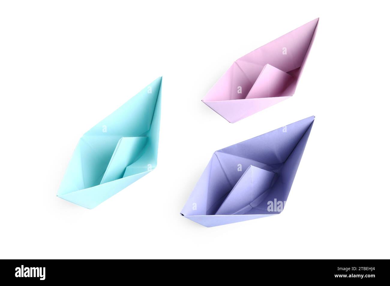 Colorful origami boats on white background Stock Photo - Alamy