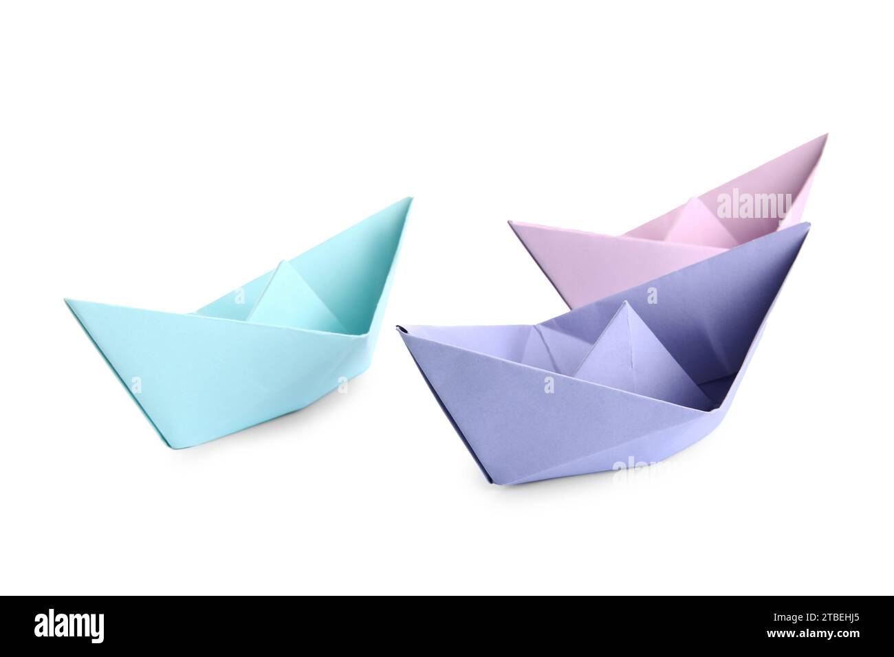 Colorful origami boats on white background Stock Photo - Alamy