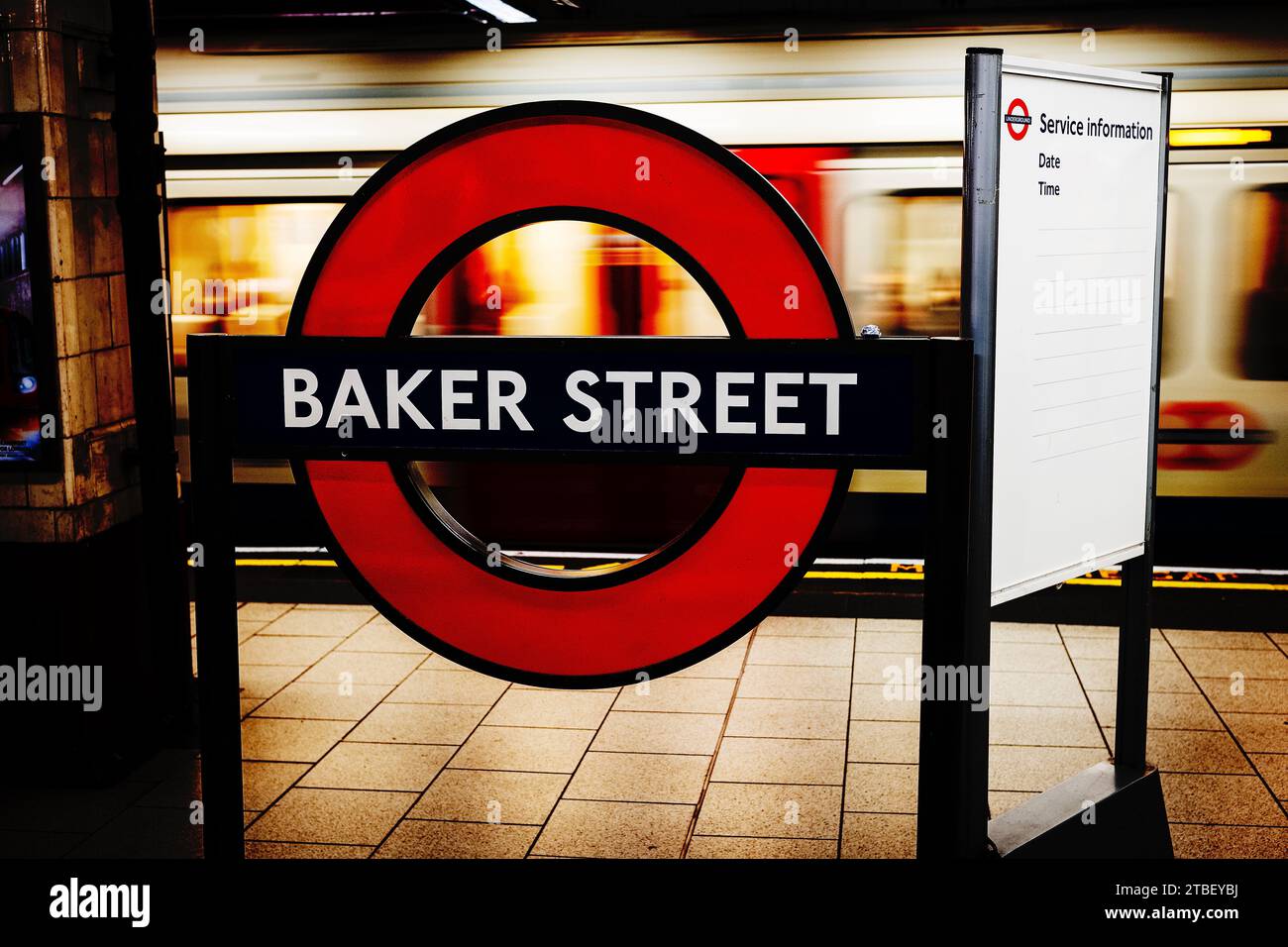 Baker Street platform sign and a train moving in the background, Baker ...