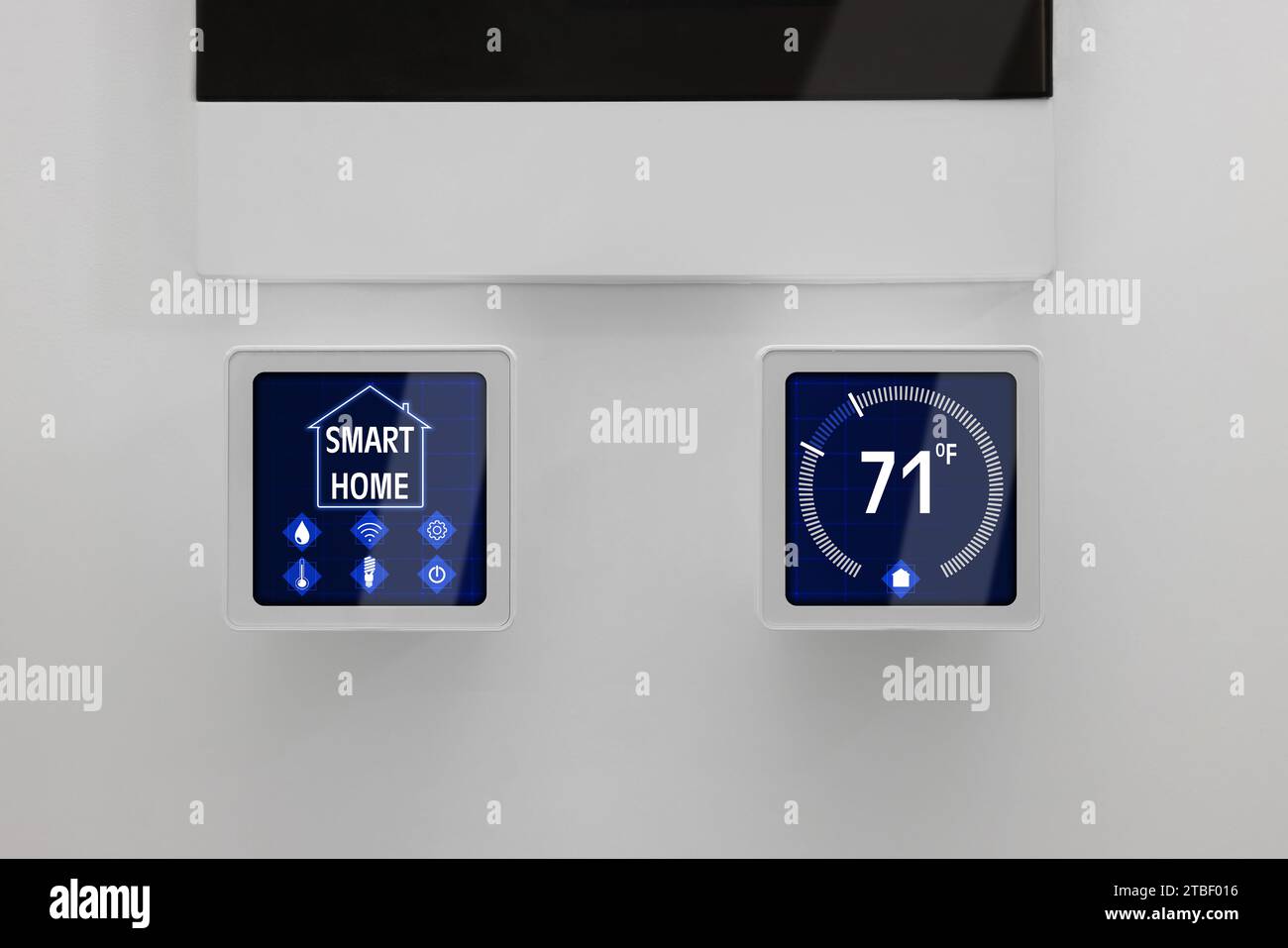 Thermostat displaying temperature in Fahrenheit scale and different icons. Smart home device on ...