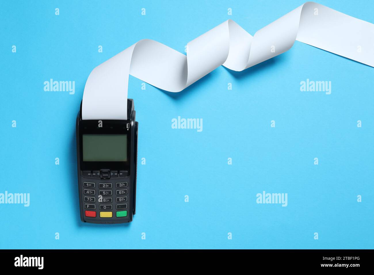 Payment terminal with thermal paper for receipt on light blue ...