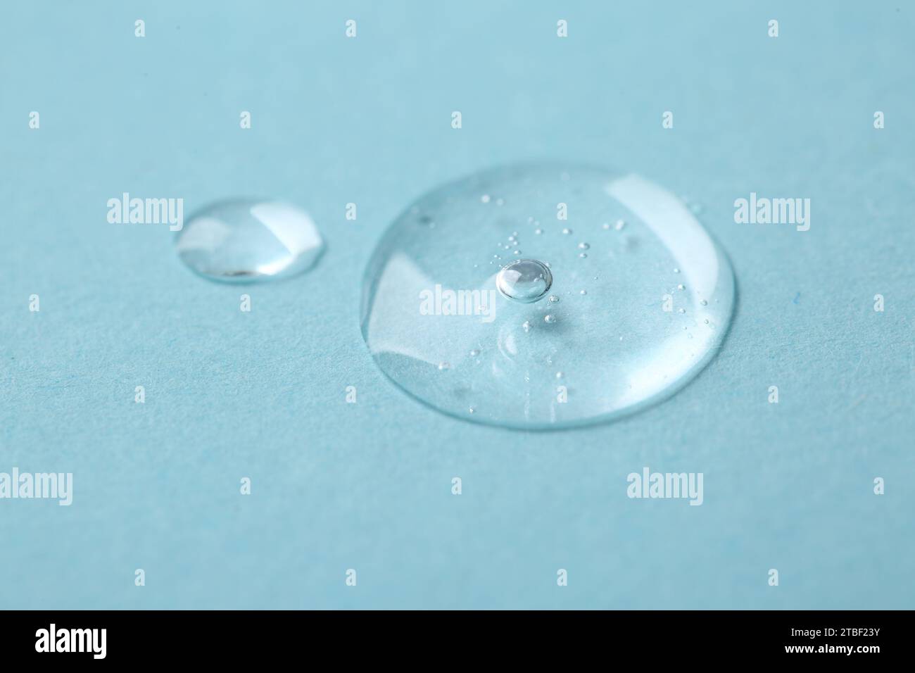 Samples of cosmetic serum on light blue background, closeup Stock Photo ...