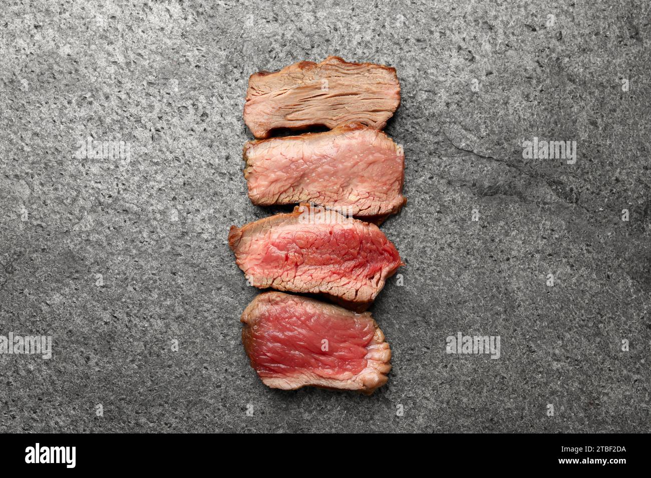 Delicious sliced beef tenderloin with different degrees of doneness on ...