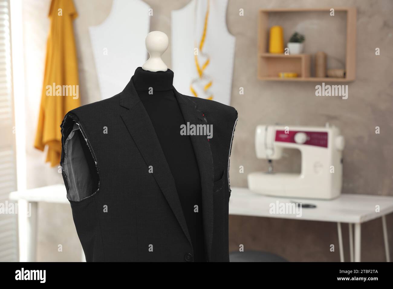 Mannequin with unfinished suit jacket in tailor shop Stock Photo - Alamy