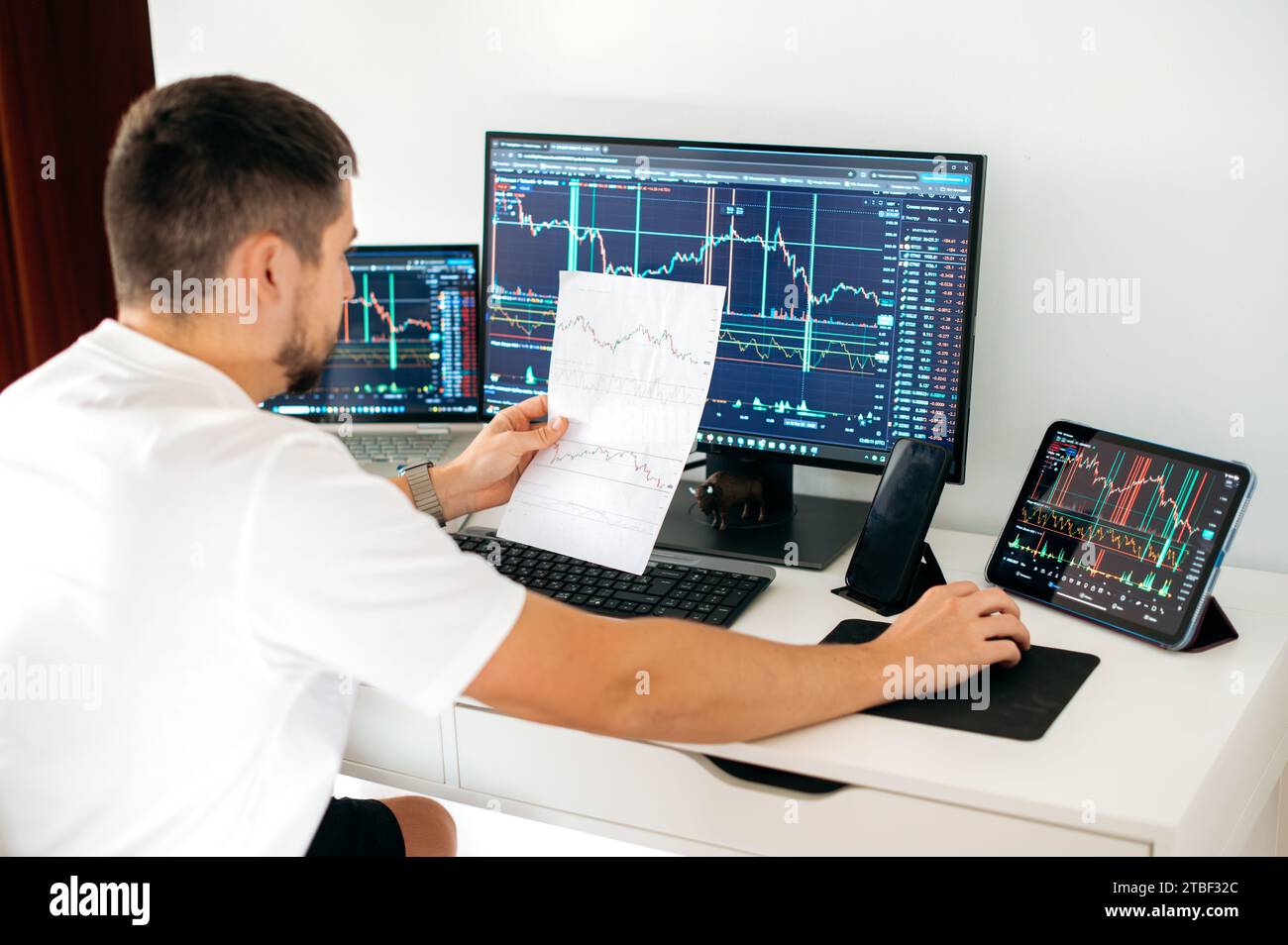 Trader man analyzing charts graph hi-res stock photography and images ...