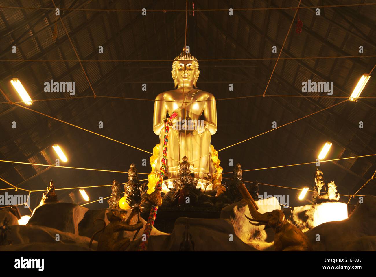 A large silver seated Buddha statue in the Pa Lelai pose. Inside the ...