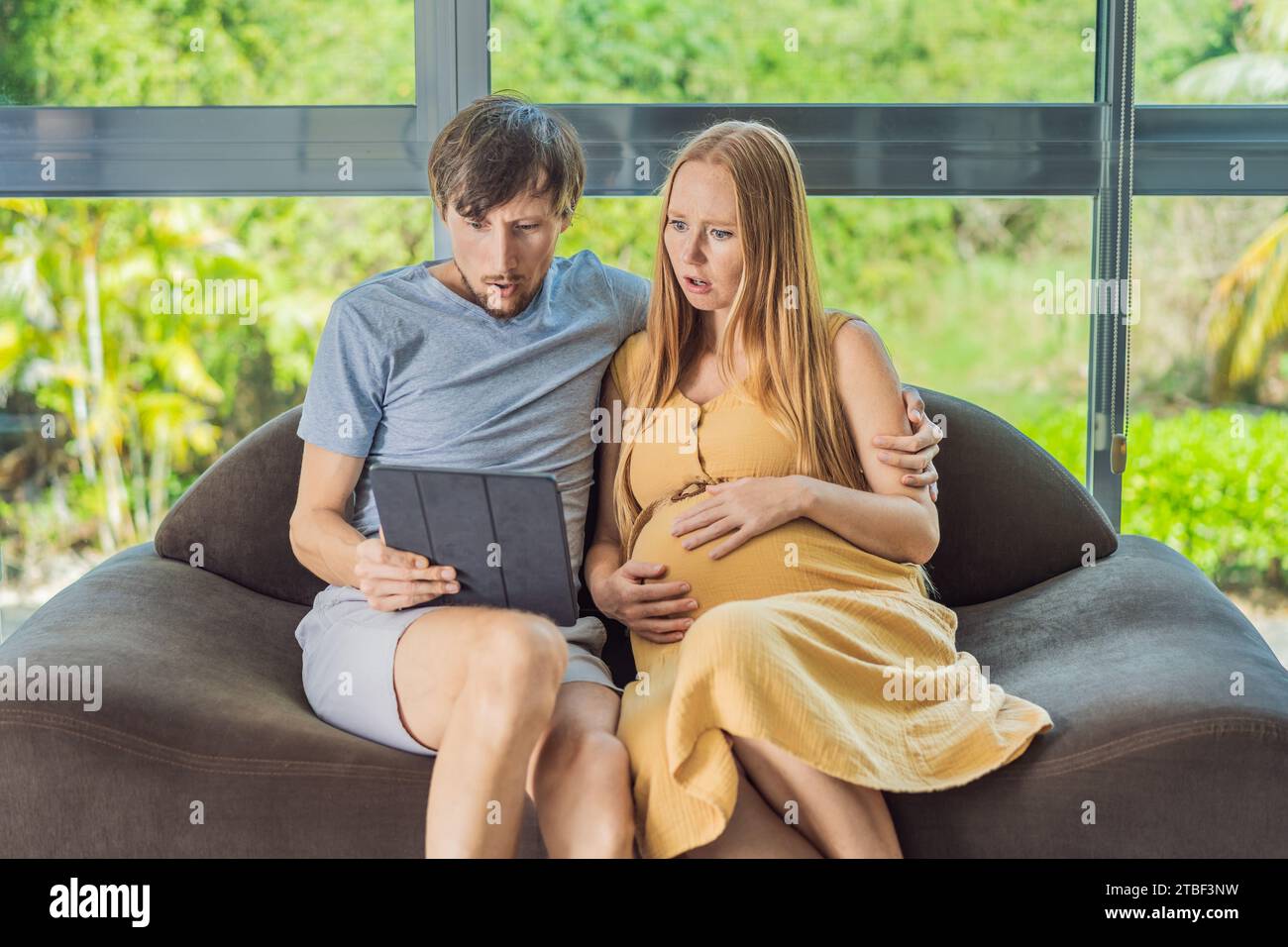 Cost of Pregnancy And Family Budgeting Concept. Young couple expecting ...