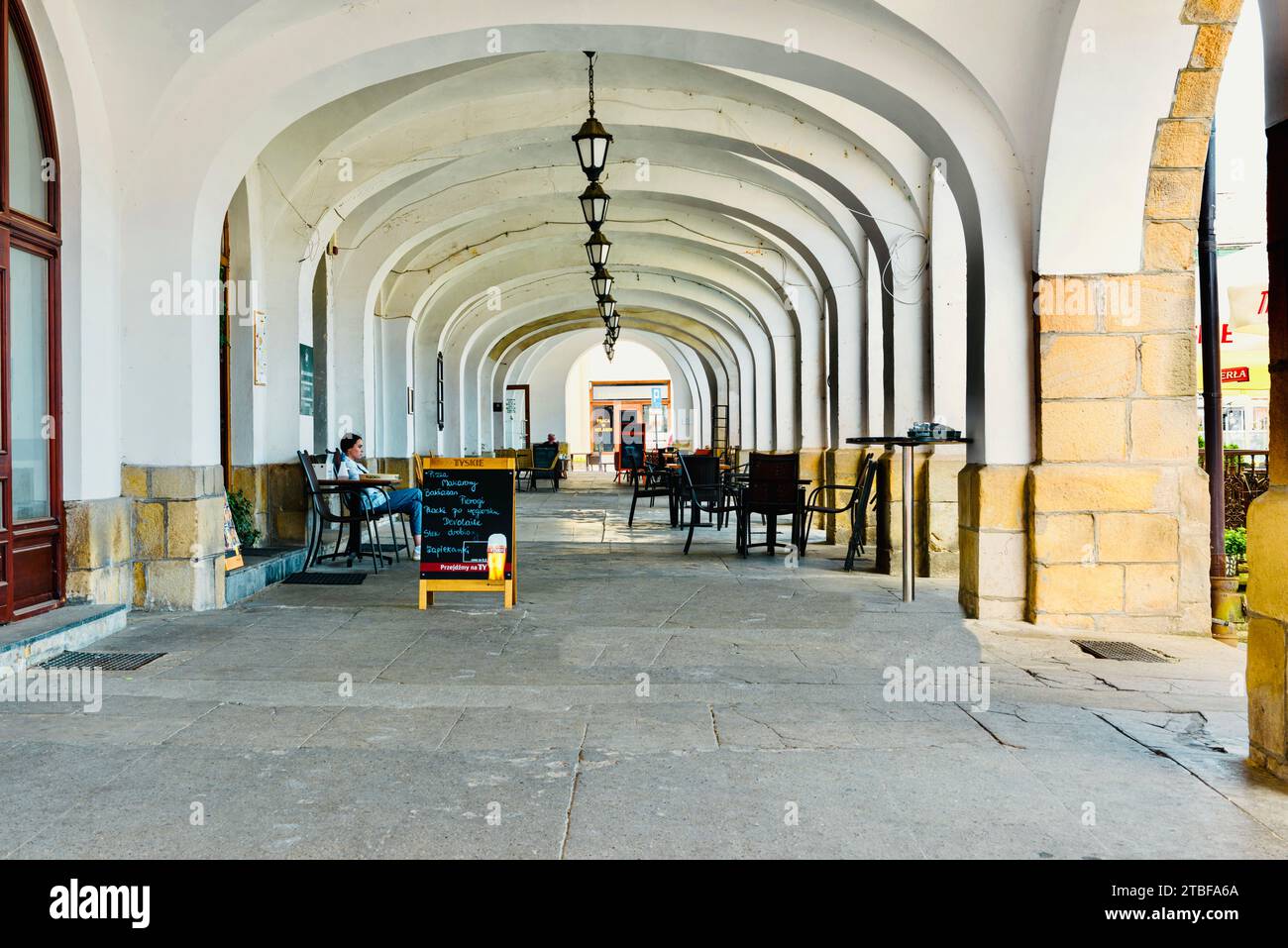 The market square is surrounded by architectural structures of ...