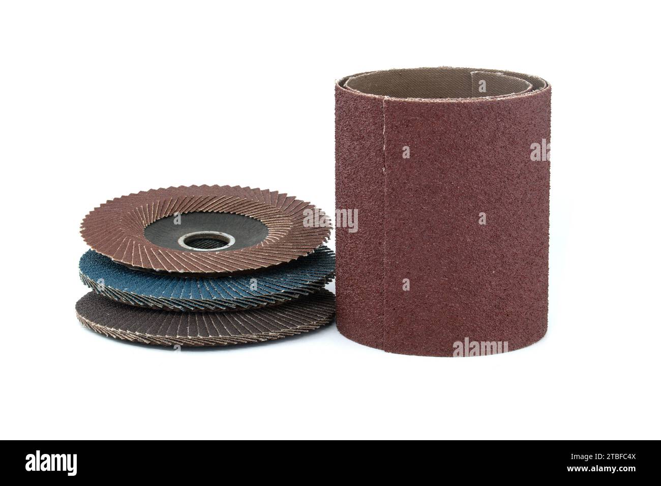 Several sanding discs and sandpaper in close-up view isolated on white ...