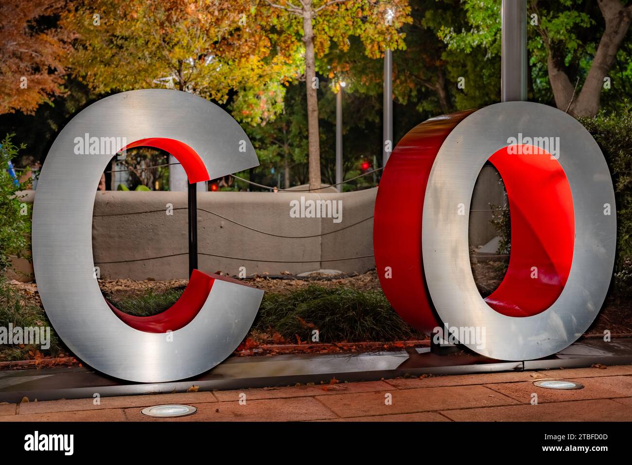 Red and gray three-dimensional 3d letters CO with an evening outdoor ...
