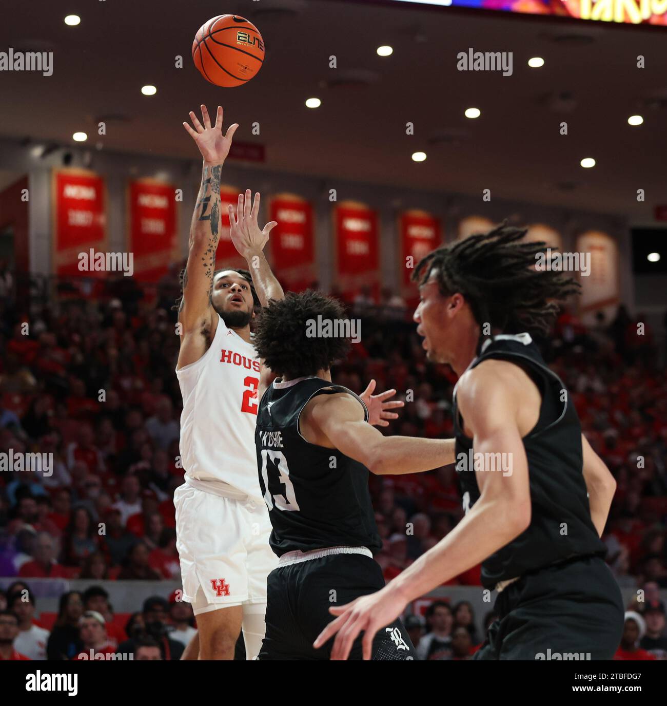 December 6, 2023: Houston guard Emanuel Sharp (21) shoots the ball ...