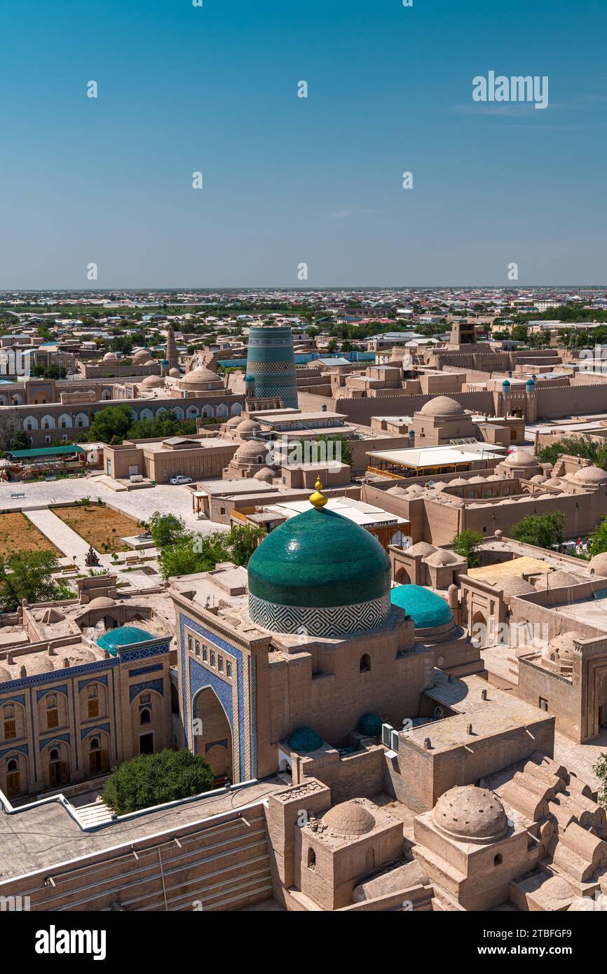 Historical buildings of Khiva (Uzbekistan) from above. Building with green dome is mausoleum of ...