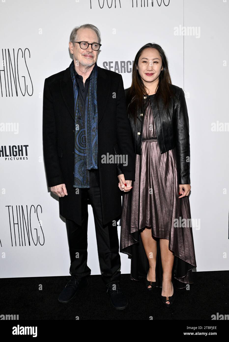 Steve Buscemi, left, and Karen Ho attend the premiere of "Poor Things" at the DGA New York ...