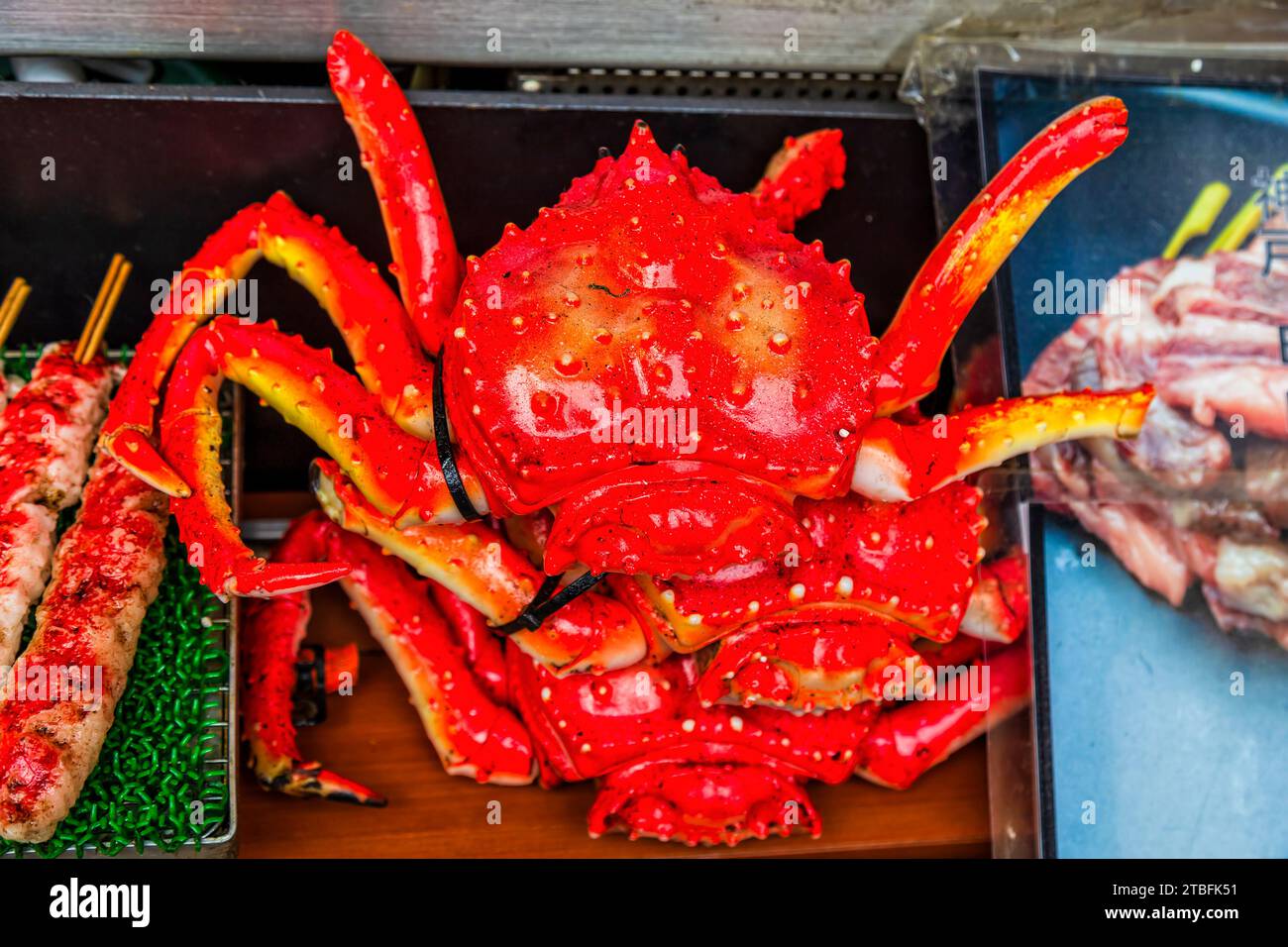 Red hot cooked crabs piled on a food stall in shopping tourism street ...