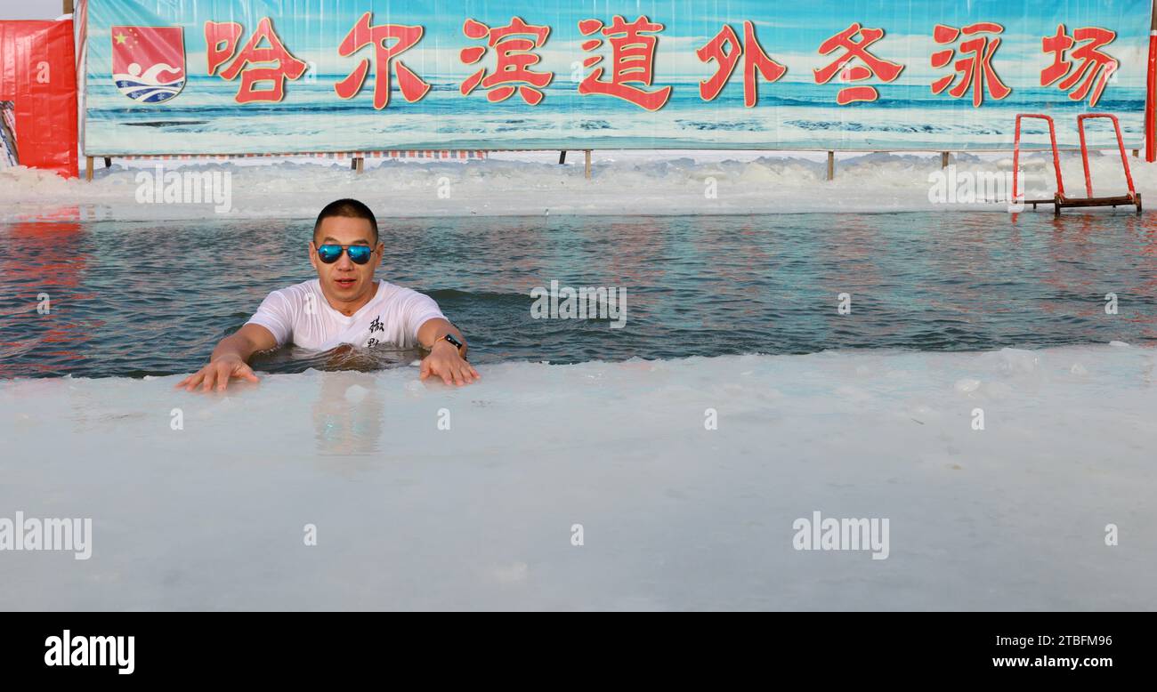 Winter swimming enthusiasts dive into the icy Songhua River in Harbin ...