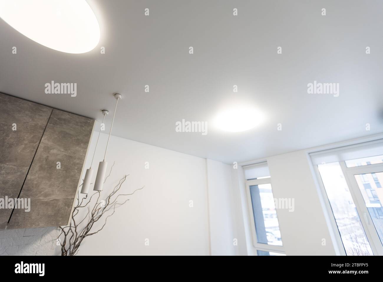 Warm light lamp hanging on the ceiling. Room interior design Stock ...