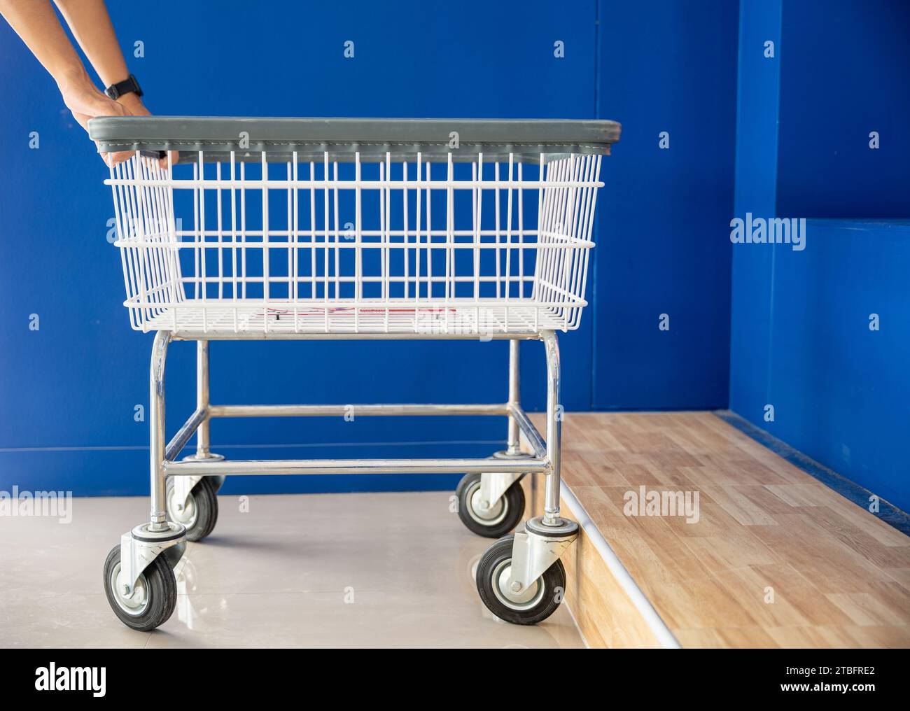 Woman hands holding empty new white trolley cart Stock Photo - Alamy