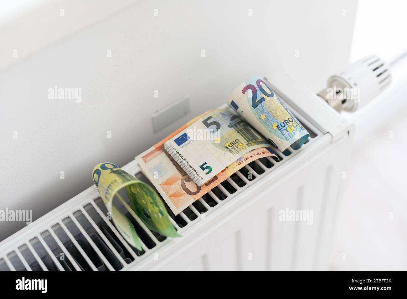 Banknotes for a heating radiator in the house. Central heating in the ...