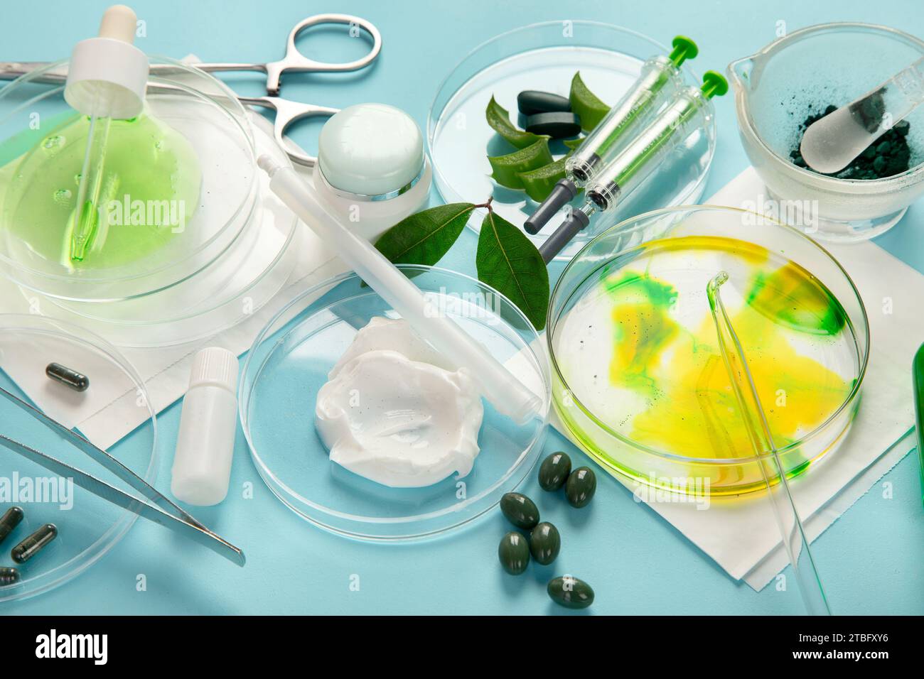 Cosmetic laboratory research on blue background. Beauty concept Stock ...