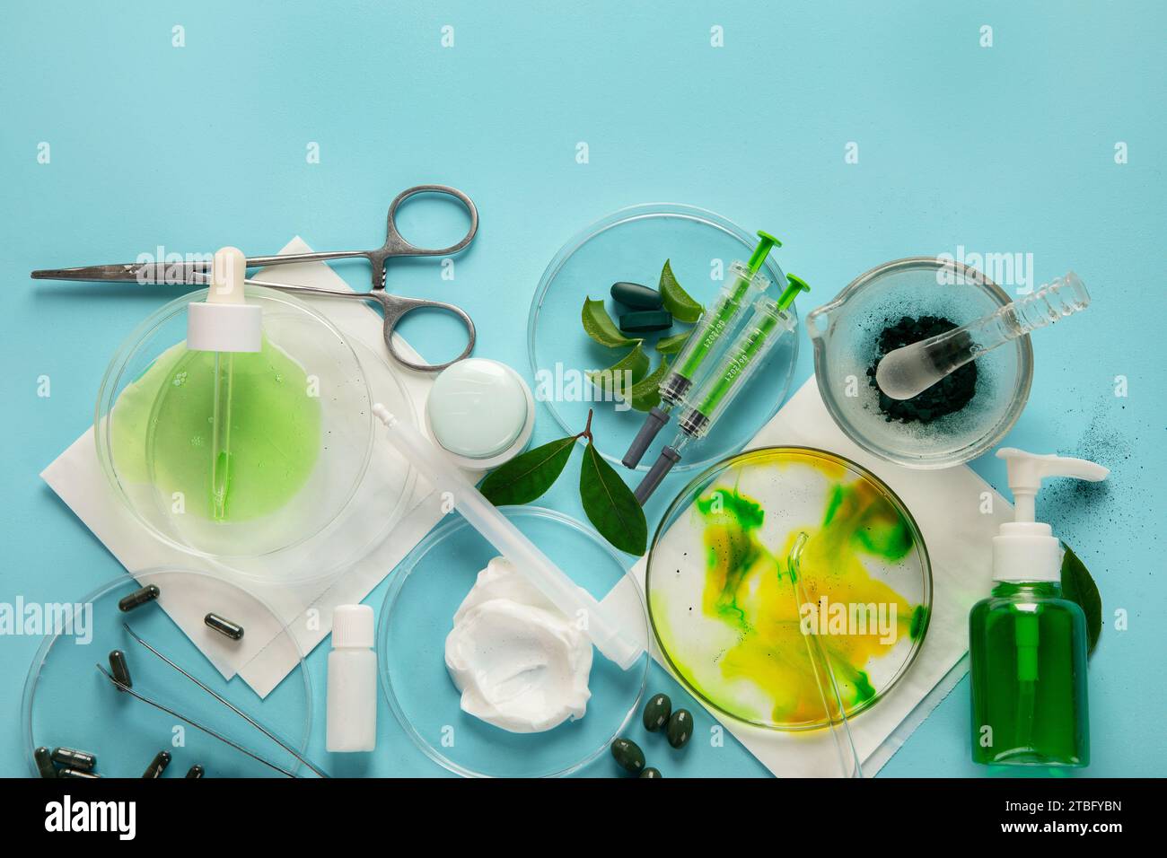 Cosmetic laboratory research on blue background. Beauty concept Stock ...