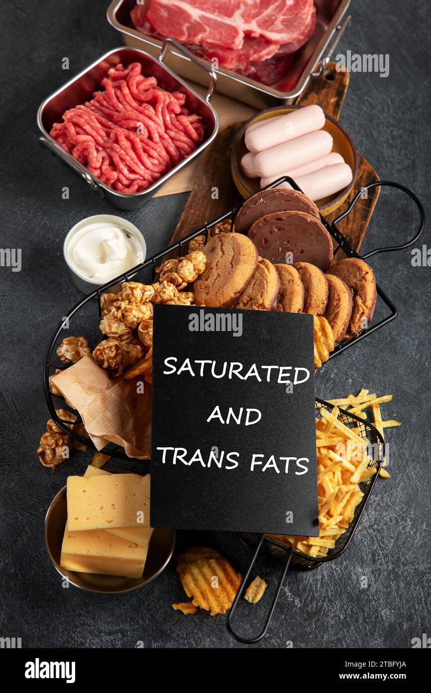 Saturated and trans. Unhealthy food. Sausage, potato, meat, cheese ...