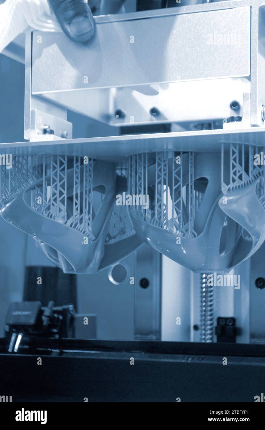 Printed models on 3D printer close-up. Objects printed on photopolymer ...