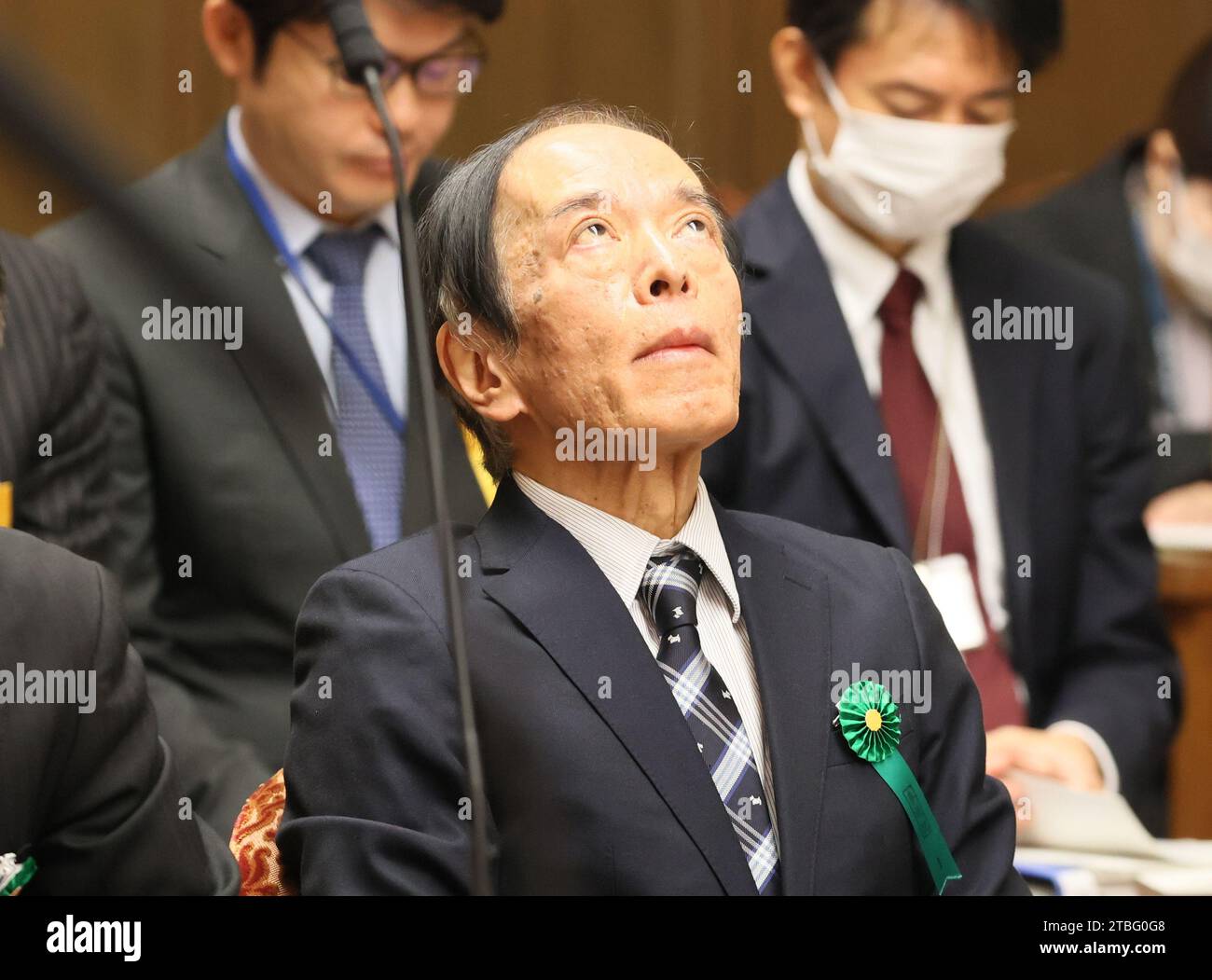 Tokyo, Japan. 7th Dec, 2023. Bank of Japan Governor Kazuo Ueda looks up ...