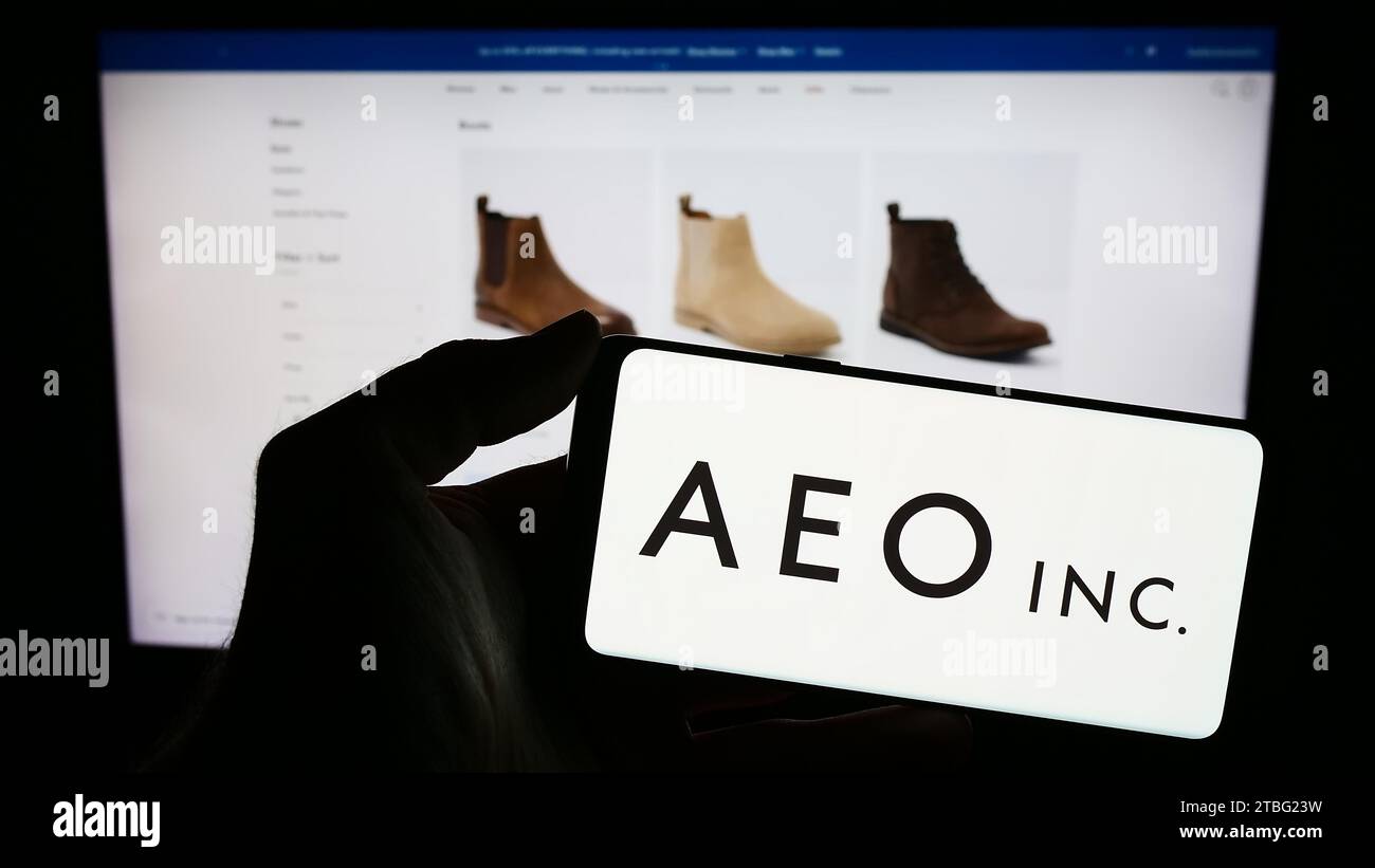 Person holding smartphone with logo of US retail company American Eagle ...