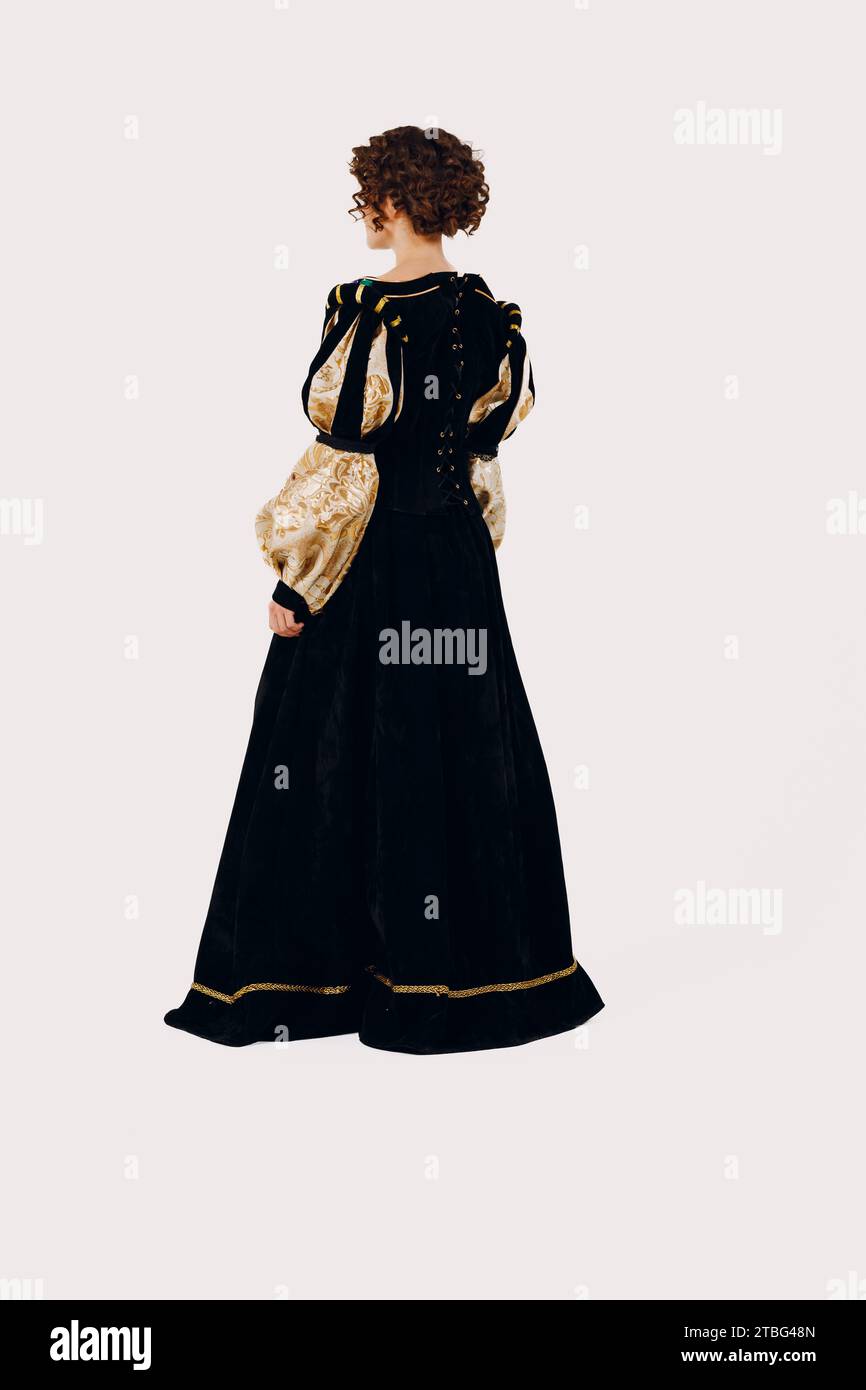 Portrait of a young aristocratic woman dressed in a medieval dress on ...