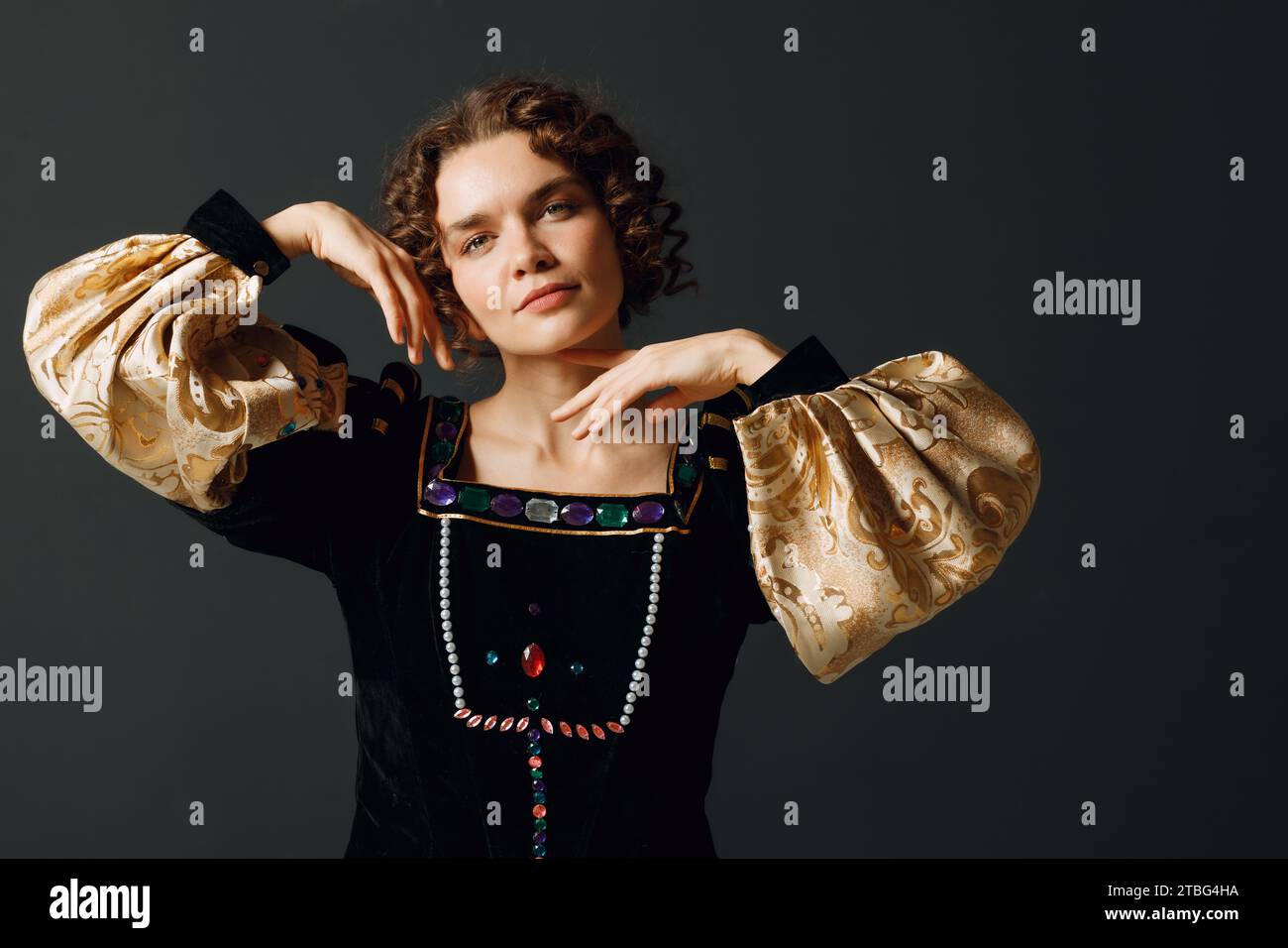 Portrait of a young aristocratic woman dressed in a medieval dress ...