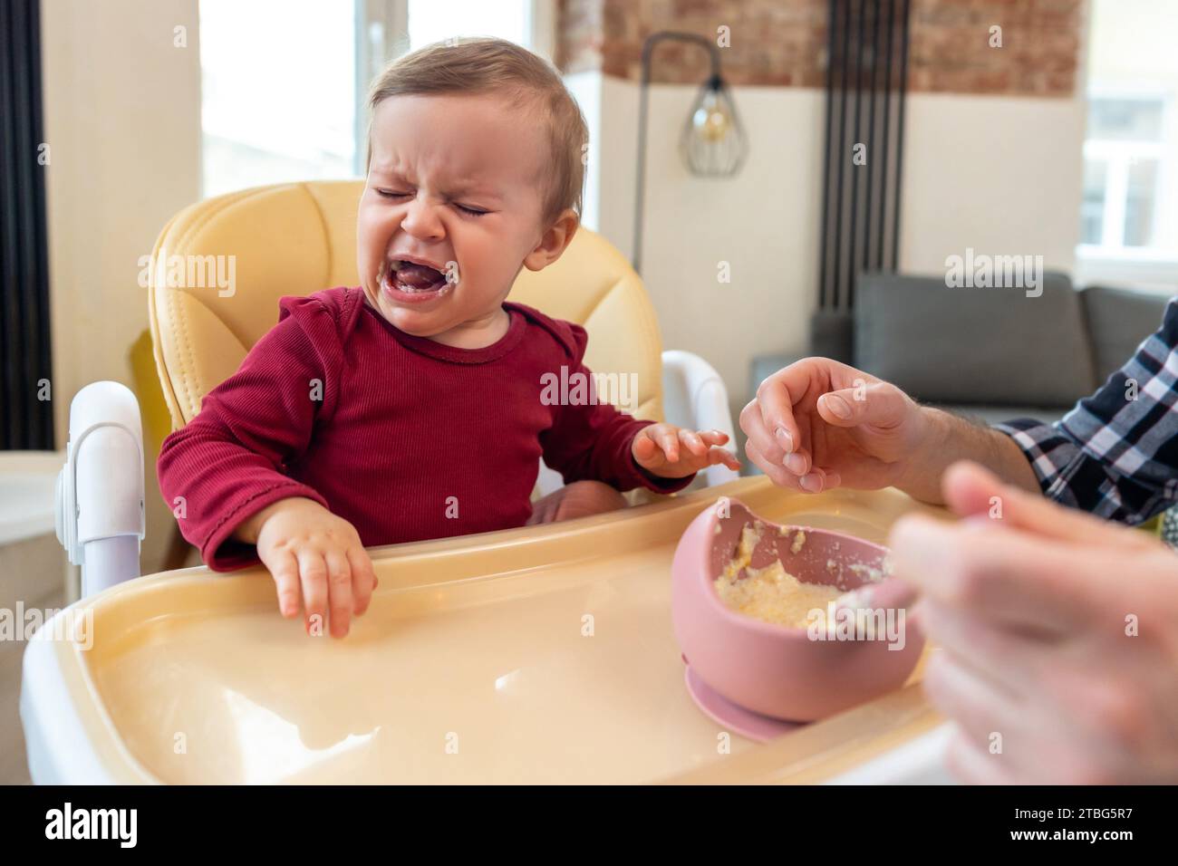 Baby crying food feeding hi-res stock photography and images - Alamy