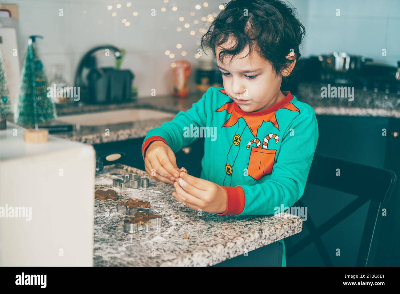 In a cozy kitchen, a happy mom and her son bond over Christmas ...