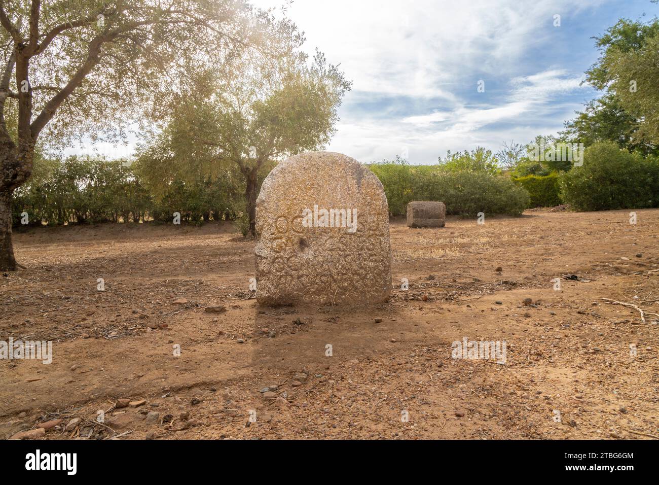 Archaeological remains of a sunlit inscribed stone Roman tombstone ...