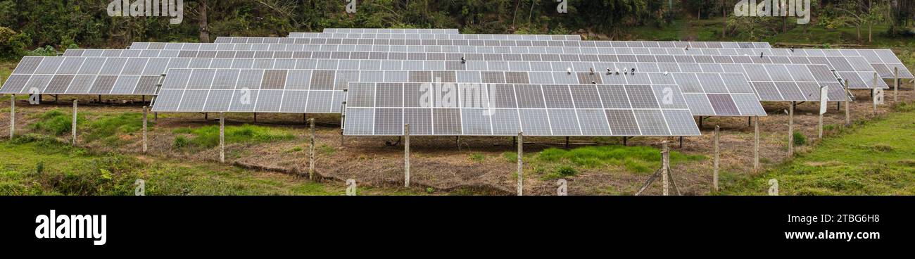 The rows of solar panels in a rural area Stock Photo - Alamy