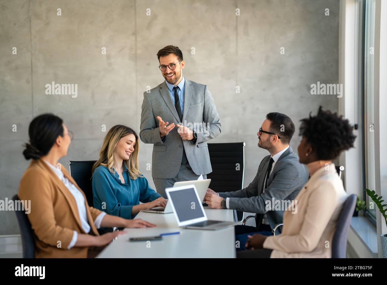 Successful multiethnic business people presenting analytical report ...