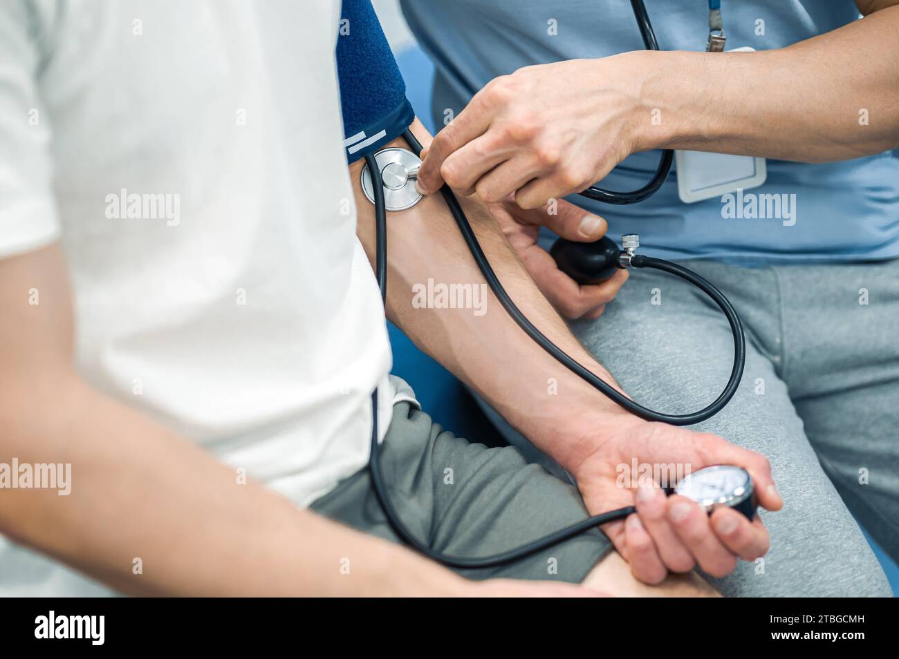 Blood pressure. Doctor checking the patients blood presser Stock Photo ...