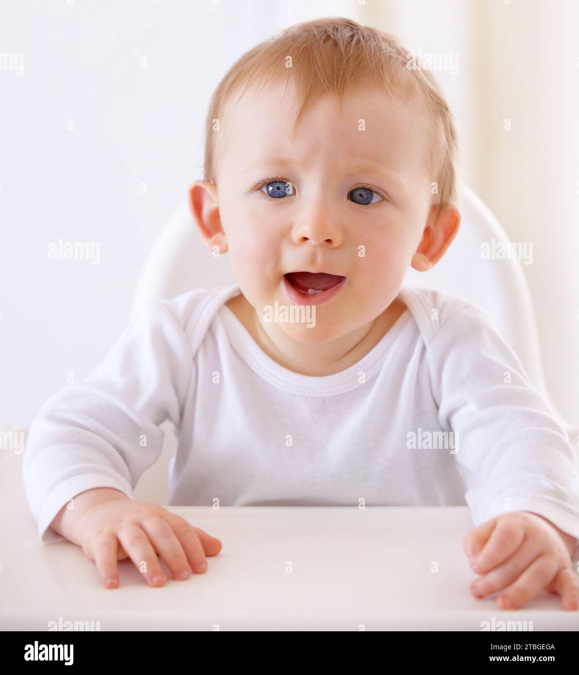 Children, hungry and a baby in a high chair for breakfast or feeding in ...