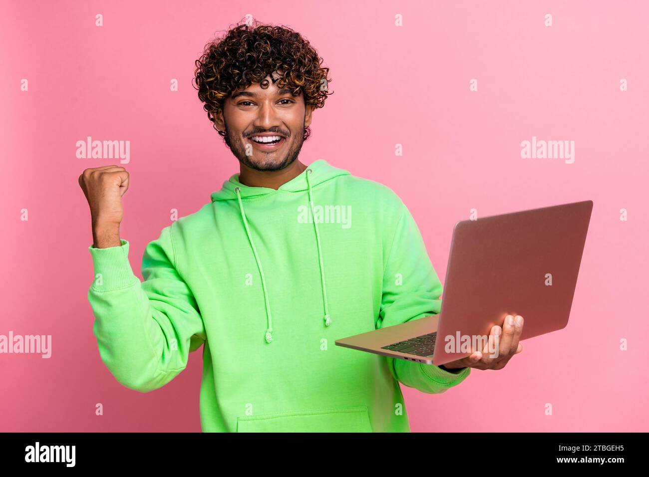 Photo of successful startup investor trader indian young guy fist up ...