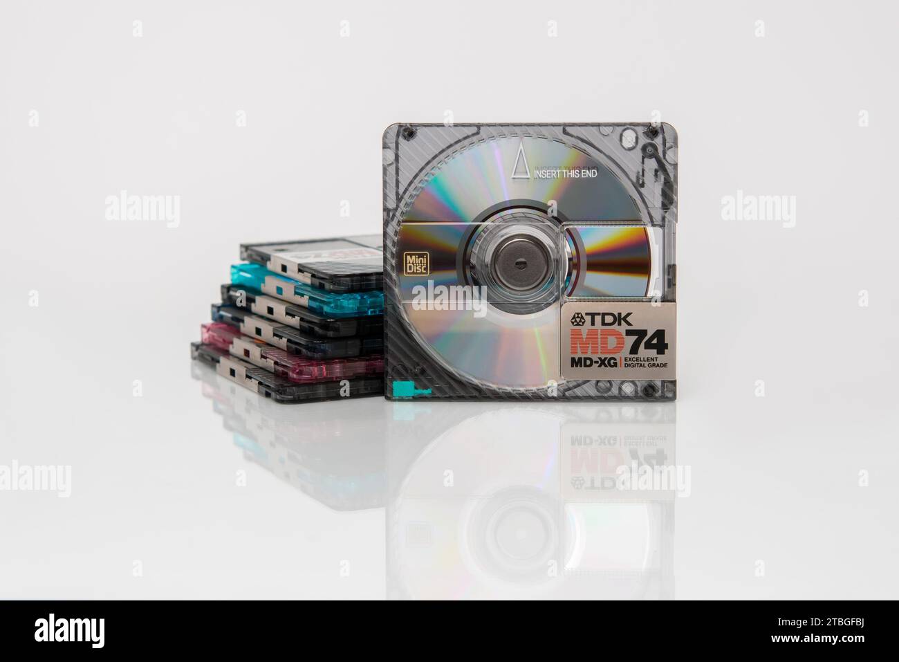 Minidisic TDK MD74 MD-XG stands vertically shimmering with iridescent ...