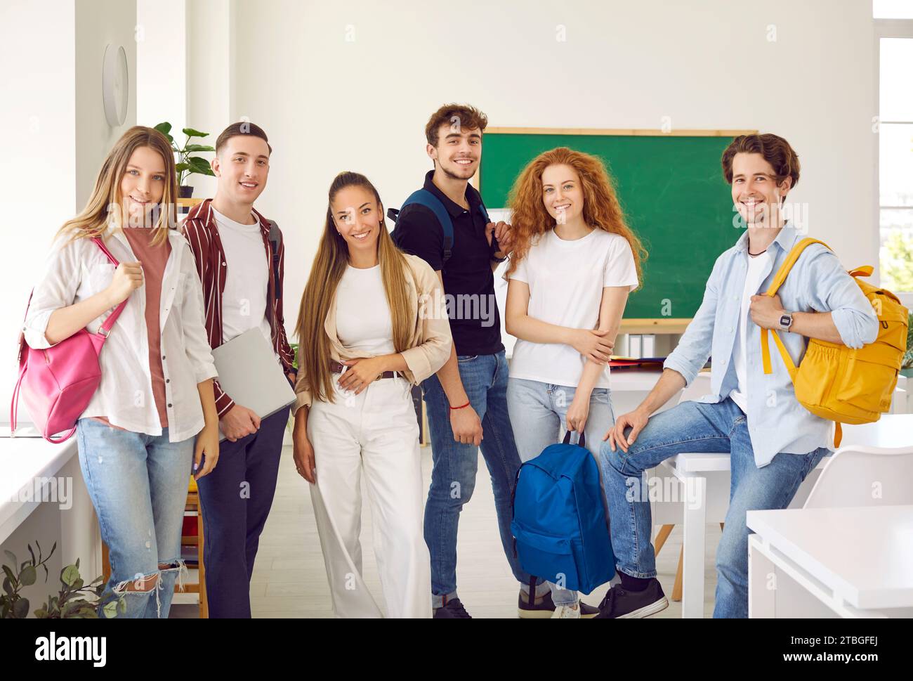 Group of school, college or university students standing together in ...