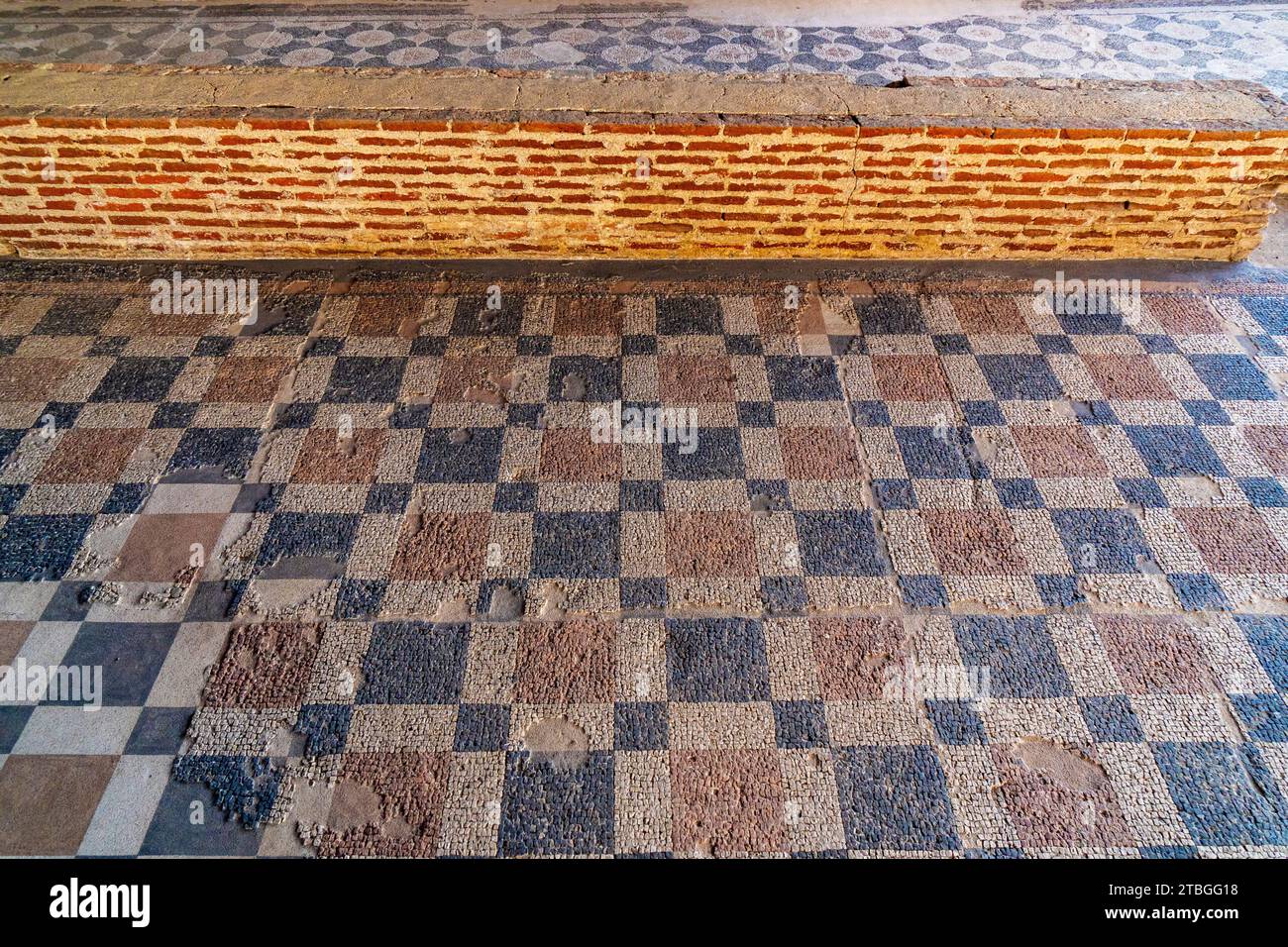 Mosaic floor of square geometric figures in blue and red colors and the ...