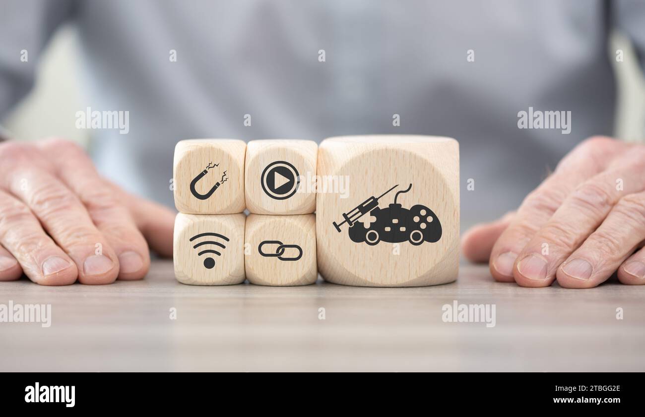 Wooden blocks with symbol of video game addiction concept Stock Photo ...