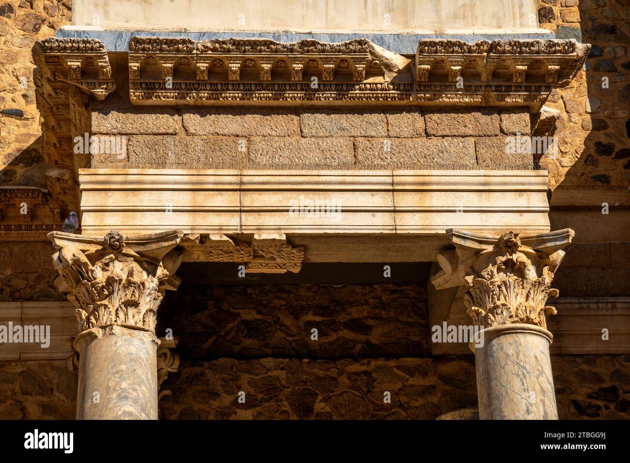 Ornate cornice with perched dove of the Roman Theater of Mérida with Greek and Roman marble ...