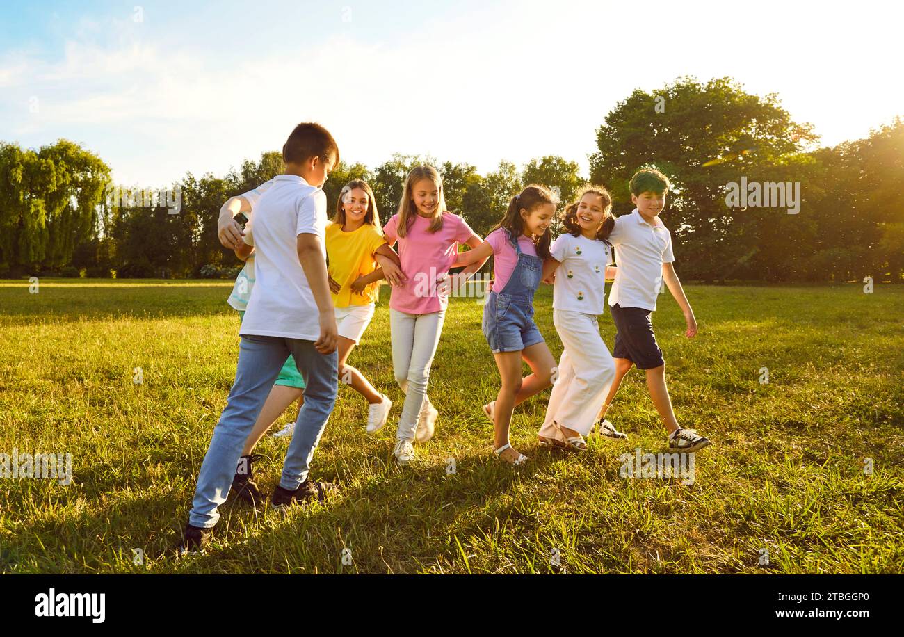 Happy playful kids friends playing active outdoor games in the summer ...