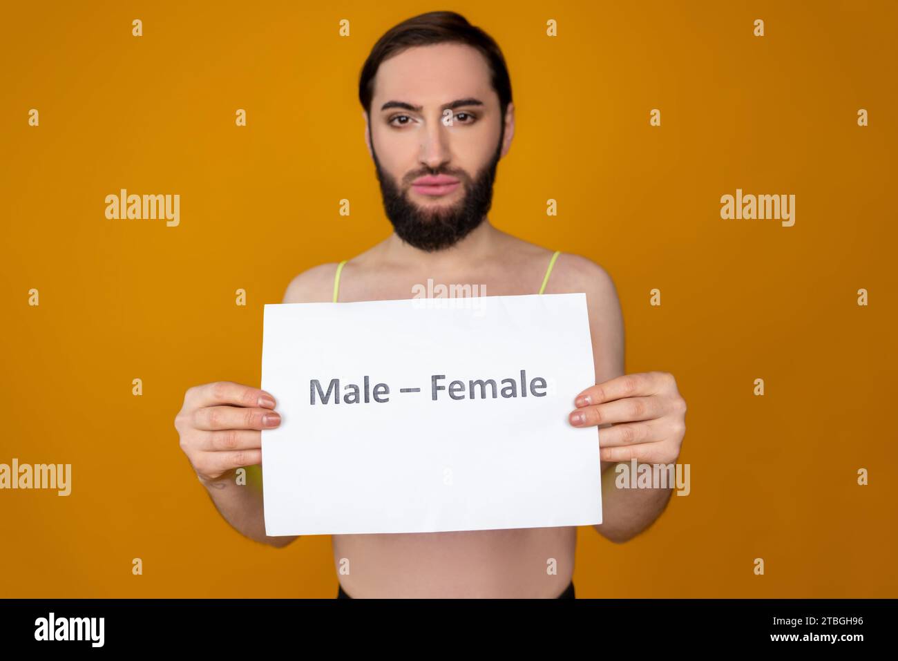 Serious Bearded Transsexual Person Holding Paper With Male Female 4763