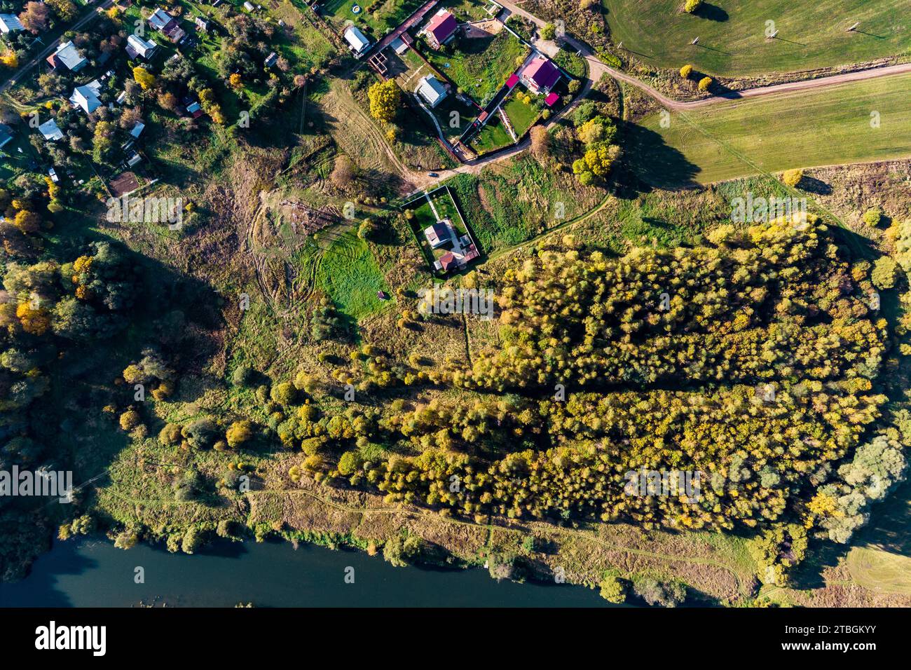 Top view at right angles down to earth with countryside in river area ...