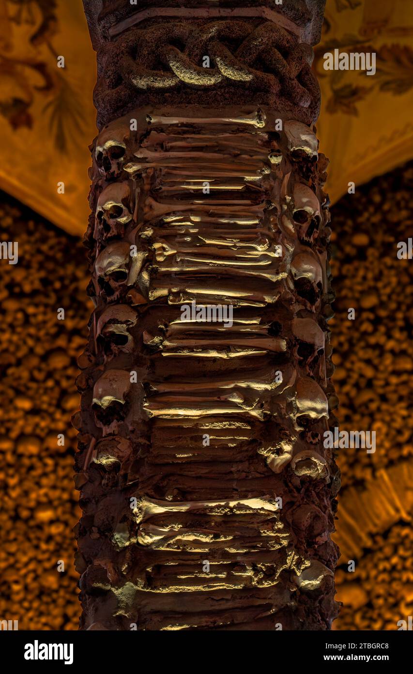 Column decorated with human bones with human skulls on the sides ...